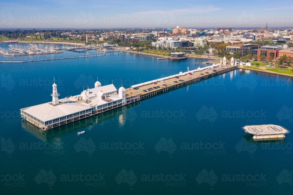 Image of Aerial view of a long straight jetty with buildings on the end ...
