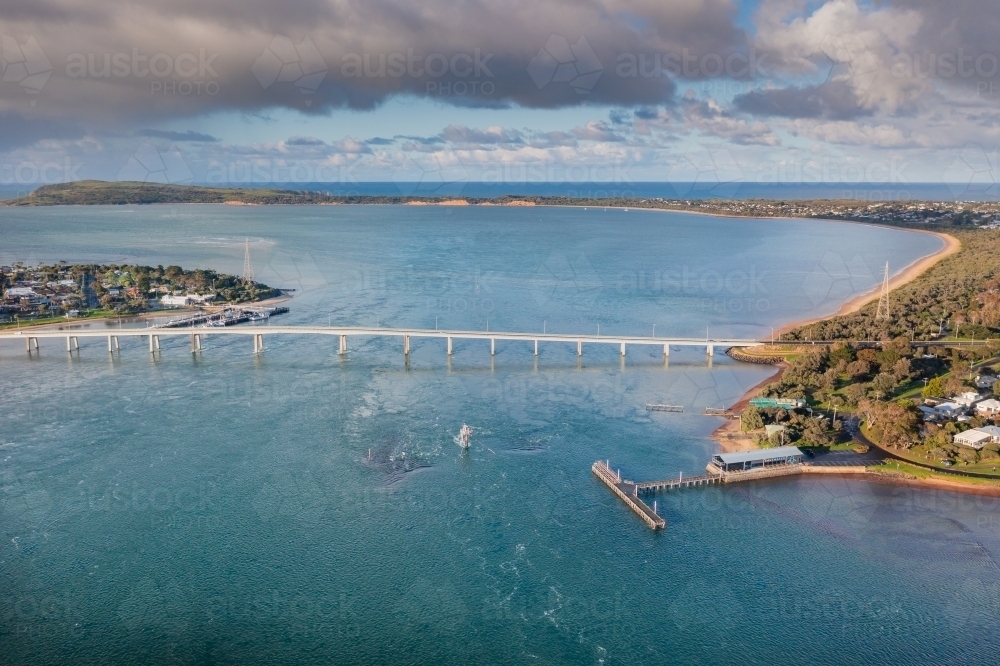 Image of Aerial view of a narrow bridge linking the mainland to a ...