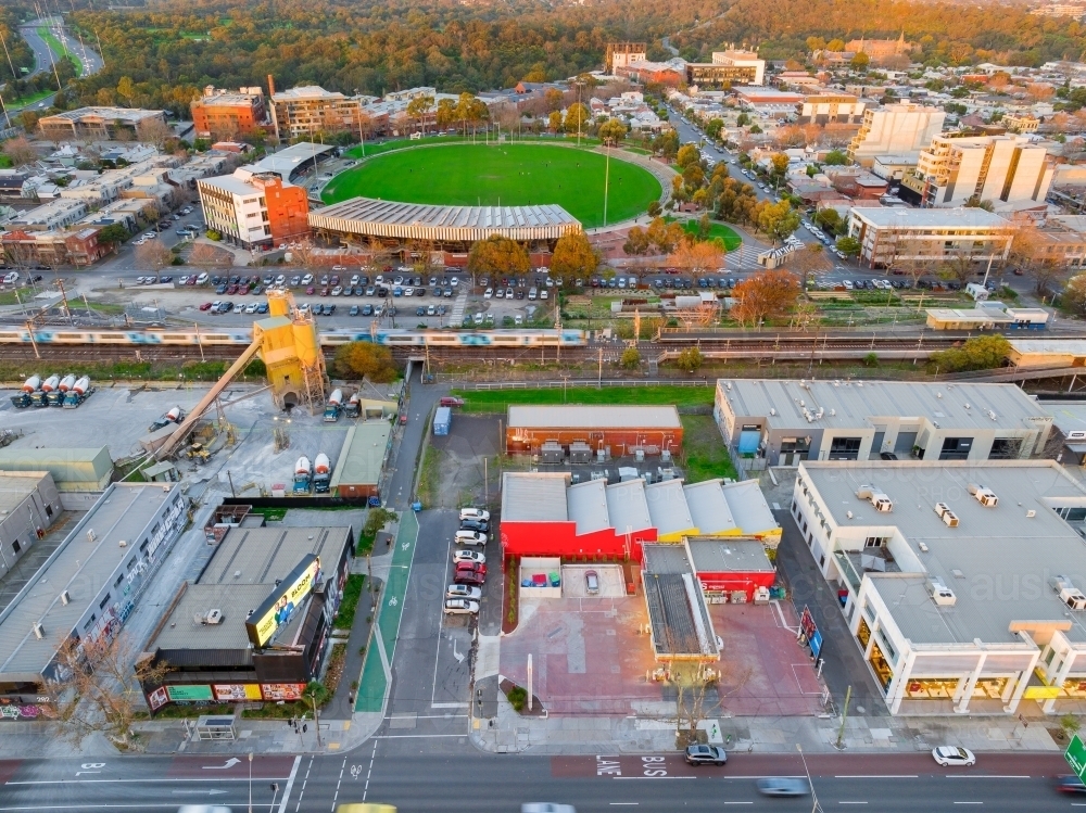 Image of Aerial view of a railway line past a football stadium and ...