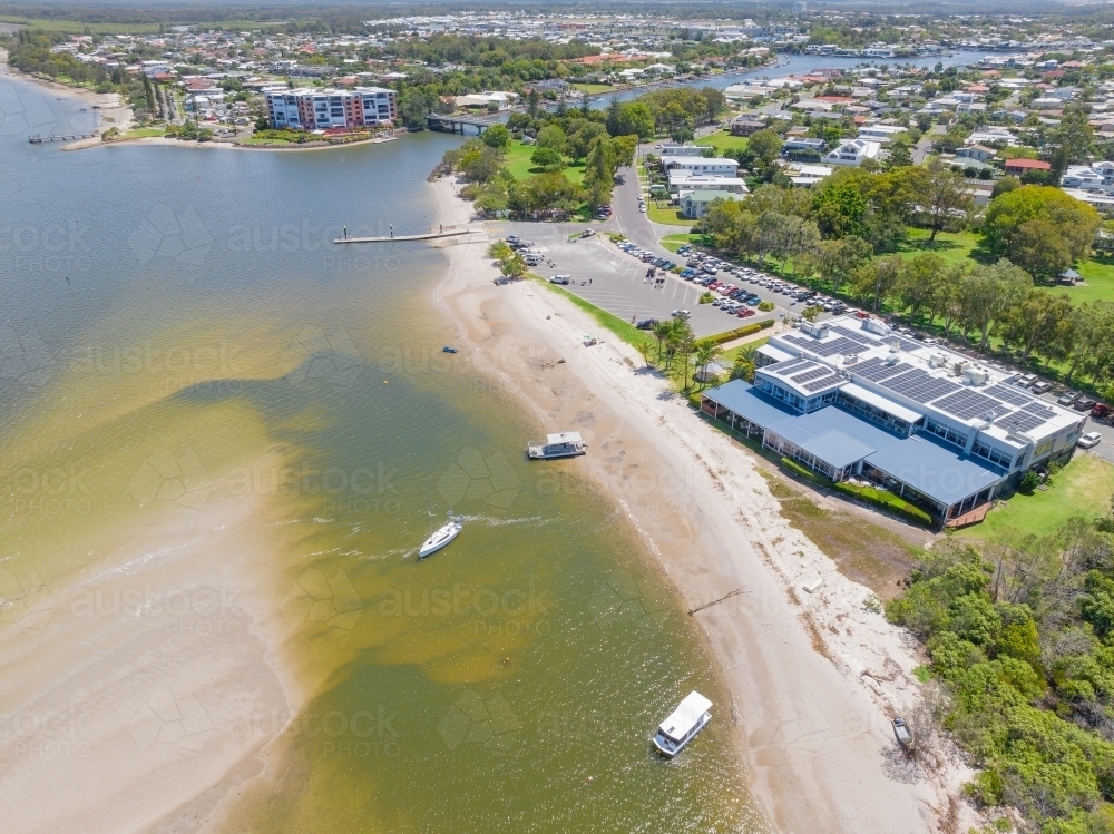 Image of Aerial view of a reception centre on the shoreline of a ...