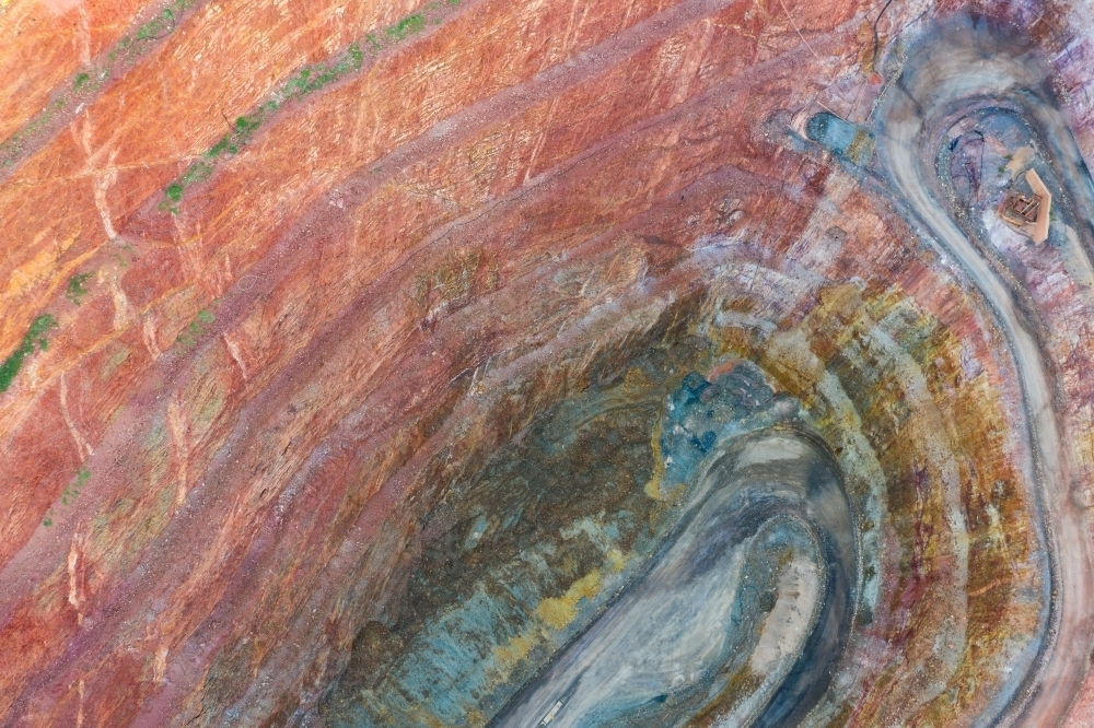 Image of Aerial view of a road winding down into a large open cut mine ...