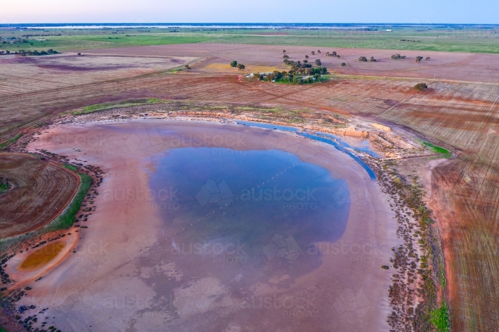 Image of Aerial view of a salt lake with colourful salt crusted edges ...