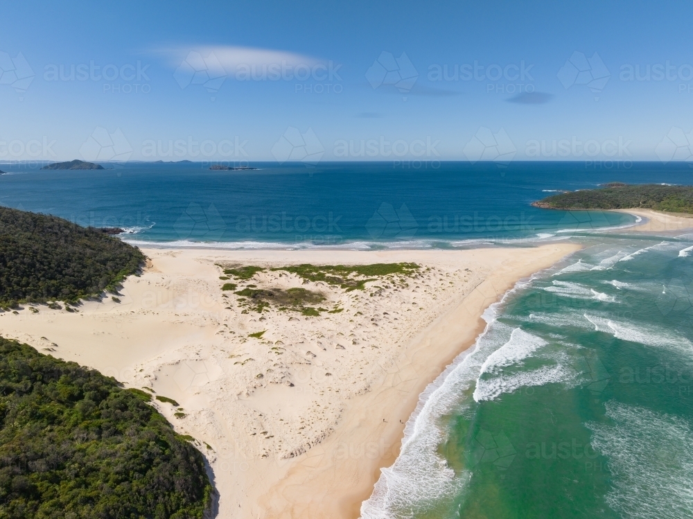 Image of Aerial view of a sand spit leading out to a coastal island ...