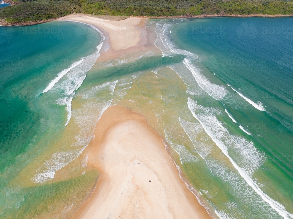 Image of Aerial view of a sand spit with blue ocean on either side ...
