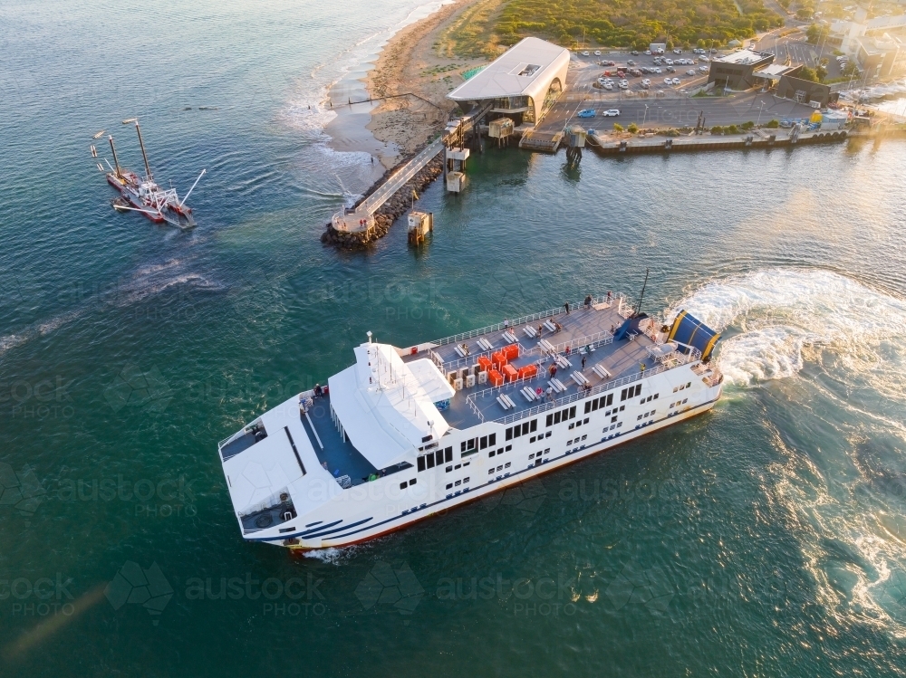 Image of Aerial view of a sea ferry at a transport terminal near a ...