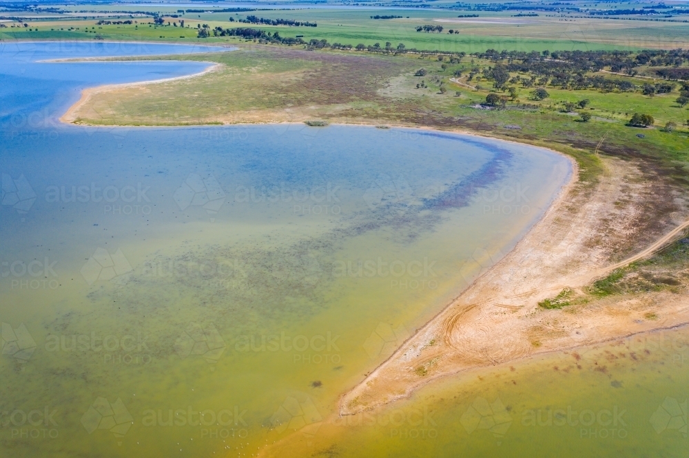 Image of Aerial view of a shallow bay around the shoreline of an inland ...