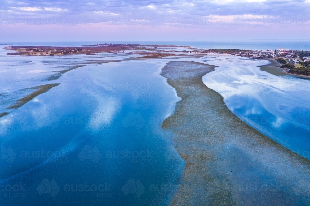 Image of Aerial view of a shallow bay with tidal currents and marshy ...