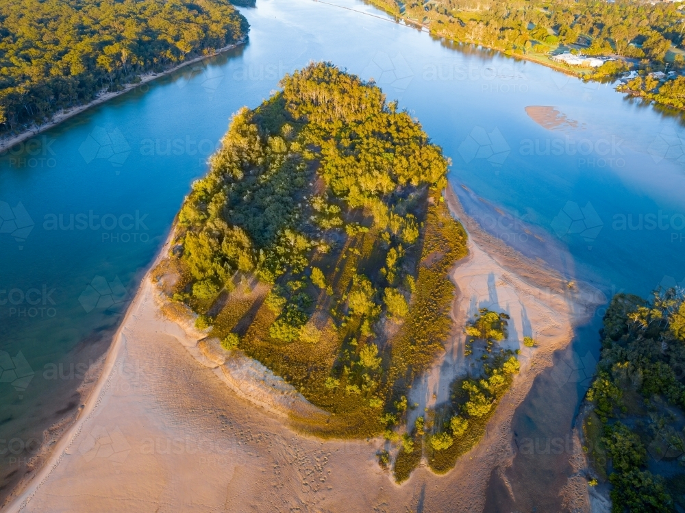 Image of Aerial view of a small island surrounded by tidal sand flats ...
