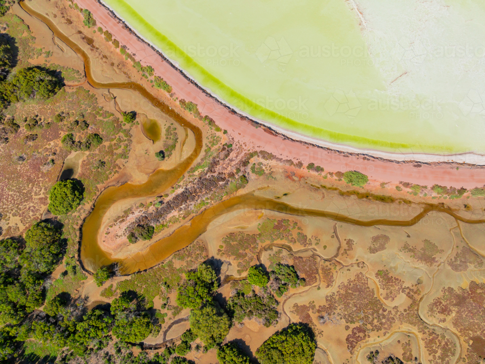 Image of Aerial view of a stream and embankment around colourful water ...