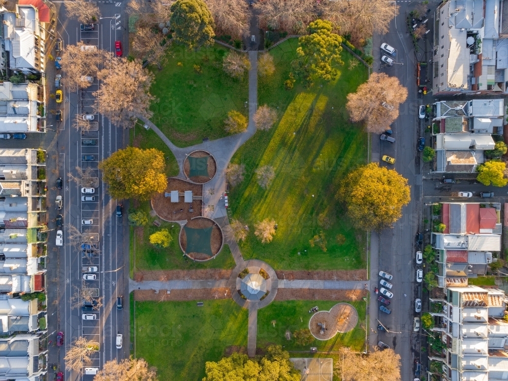 Image of Aerial view of a suburban park bordered by rows of housing ...