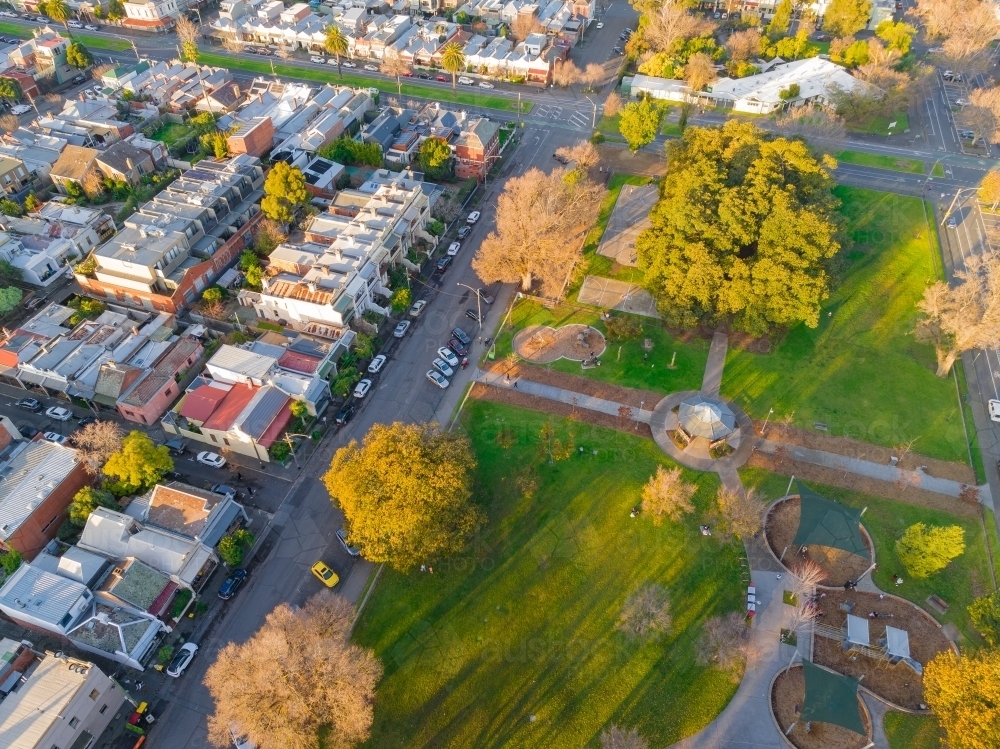 Image of Aerial view of a suburban park bordered by rows of housing ...