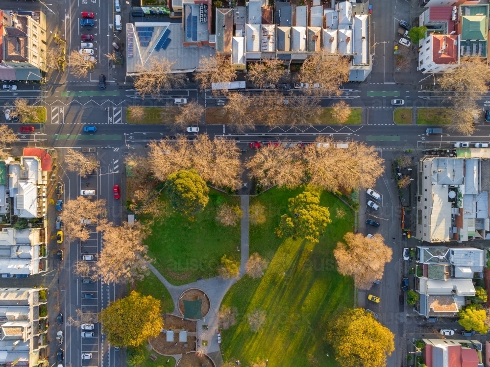 Image of Aerial view of a suburban park bordered by rows of housing ...