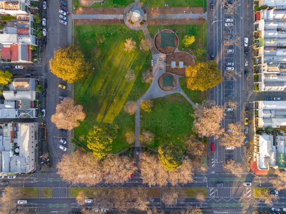 Image of Aerial view of a suburban park bordered by rows of housing ...