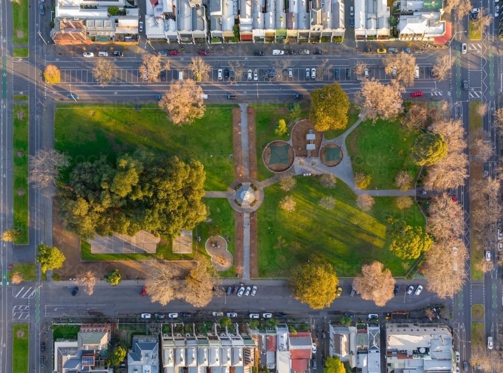 Image of Aerial view of a suburban park bordered by rows of housing ...