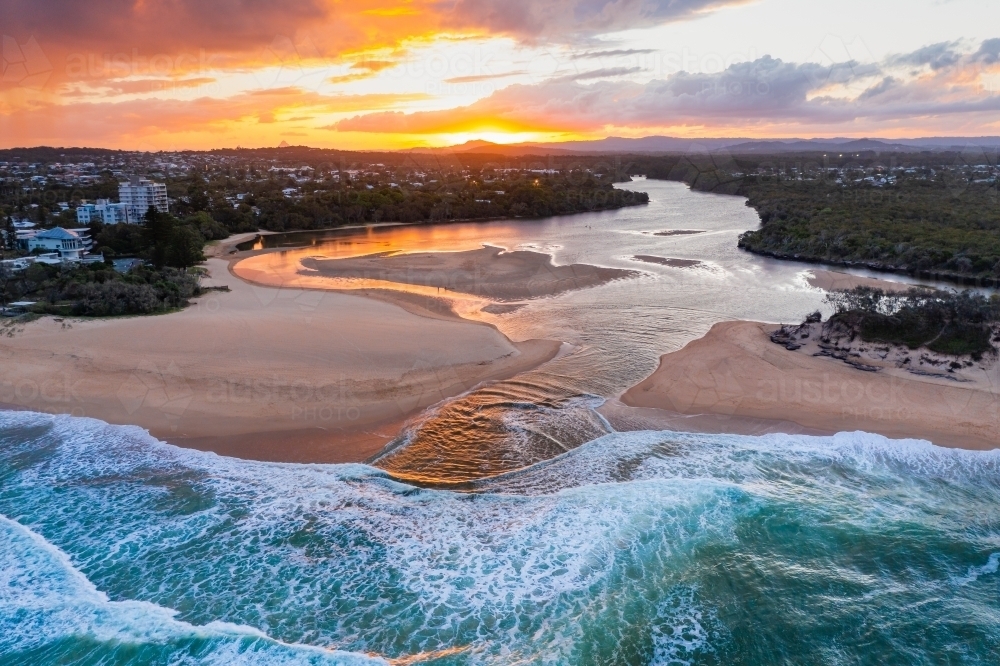 Image of Aerial view of a sunset sky over an inland lake system ...