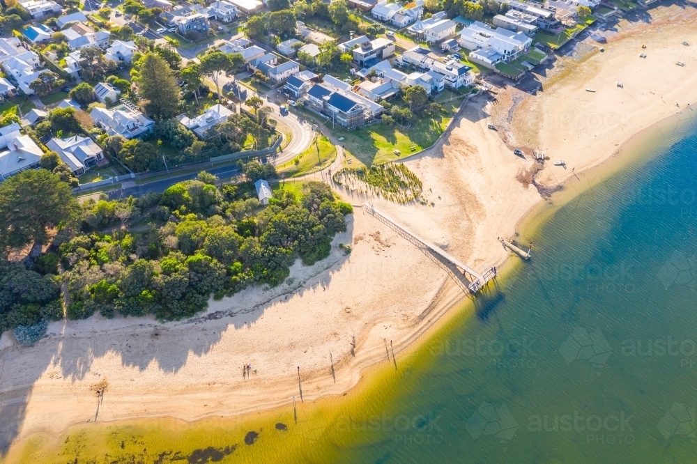 Image of Aerial view of a T shaped jetty over a beach to the shoreline ...