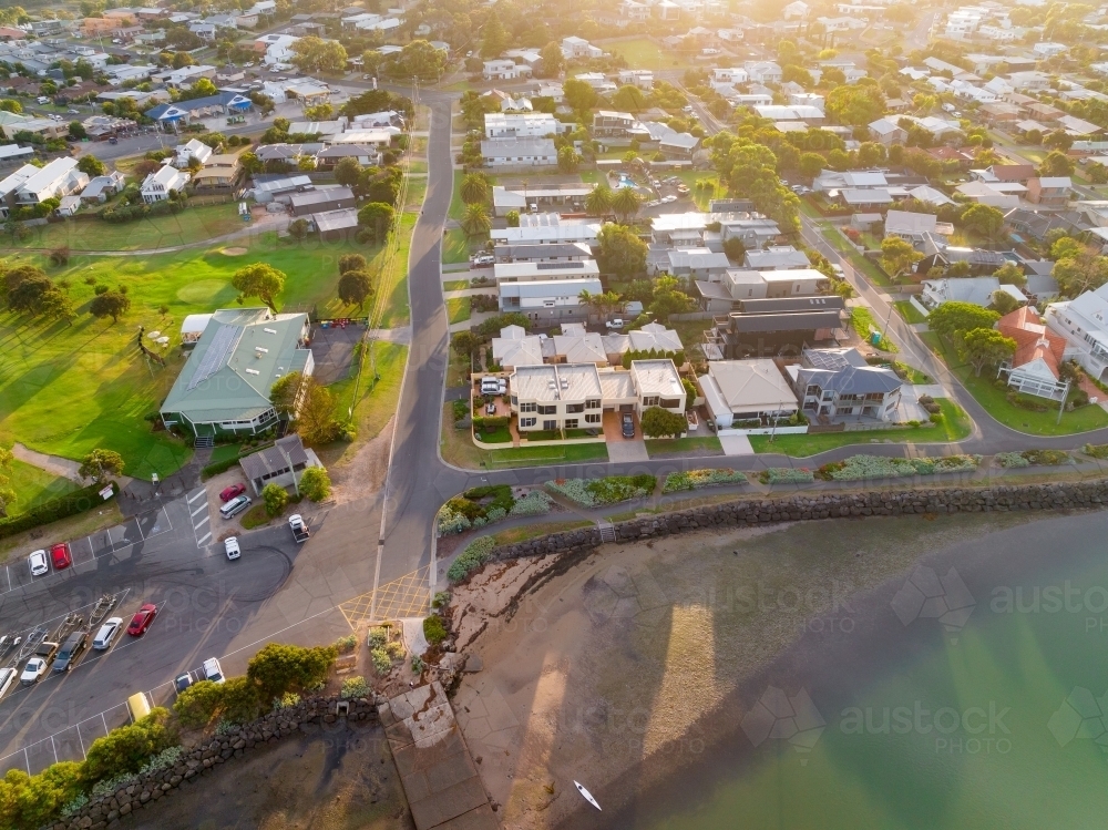 Image of Aerial view of a township and carpark on the bank of a coastal ...