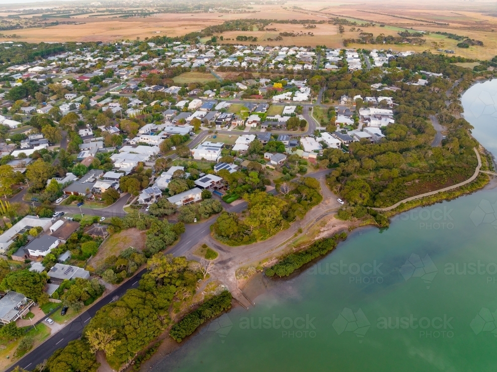 Image of Aerial view of a township on the bank of a coastal river ...
