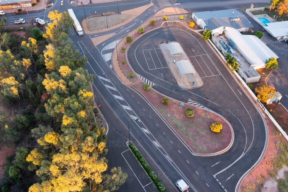 Image of Aerial view of a traffic rest stop on the side of a busy road ...