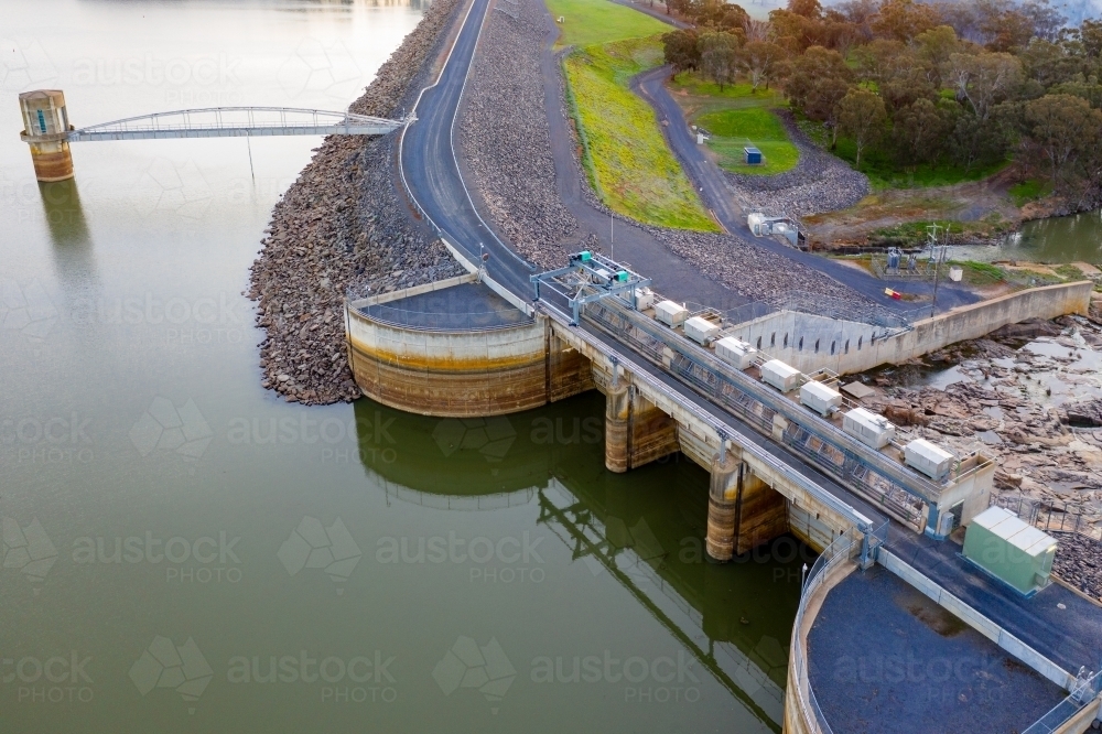 Image of Aerial view of a water tower and flood gates in a dam wall ...