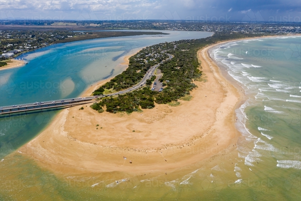 Image of Aerial view of a wide sandy beach around a narrow strip of ...