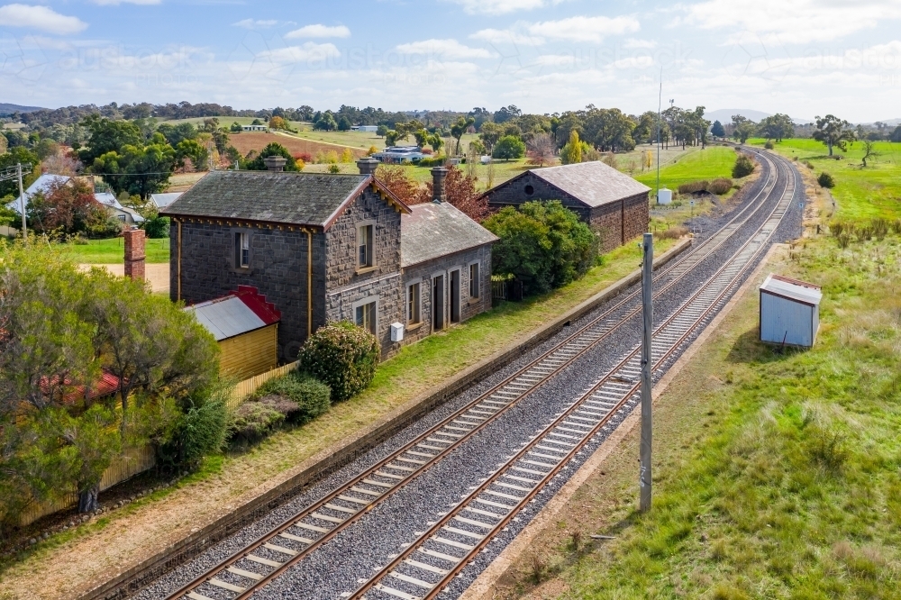 Image of Aerial view of an deserted blue stone railway station with ...