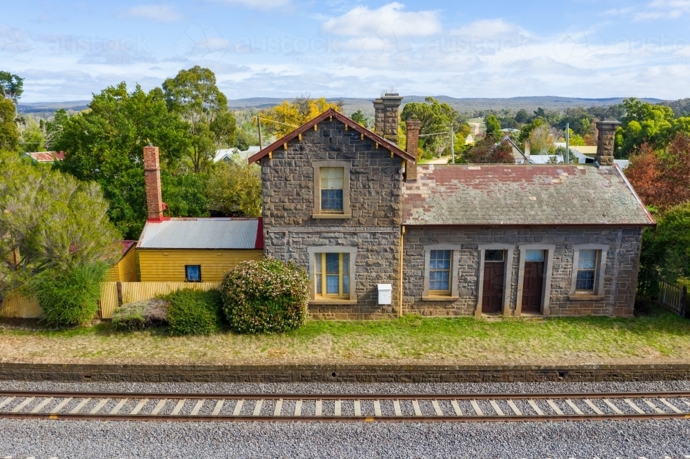 Image of Aerial view of an deserted blue stone railway station with ...