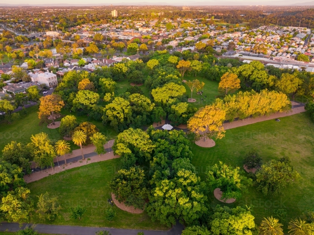 Image of Aerial view of an inner city park and suburb in late afternoon ...