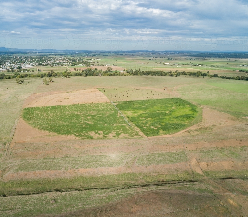 Image of Aerial view of an irrigation pivot in farm paddock - Austockphoto