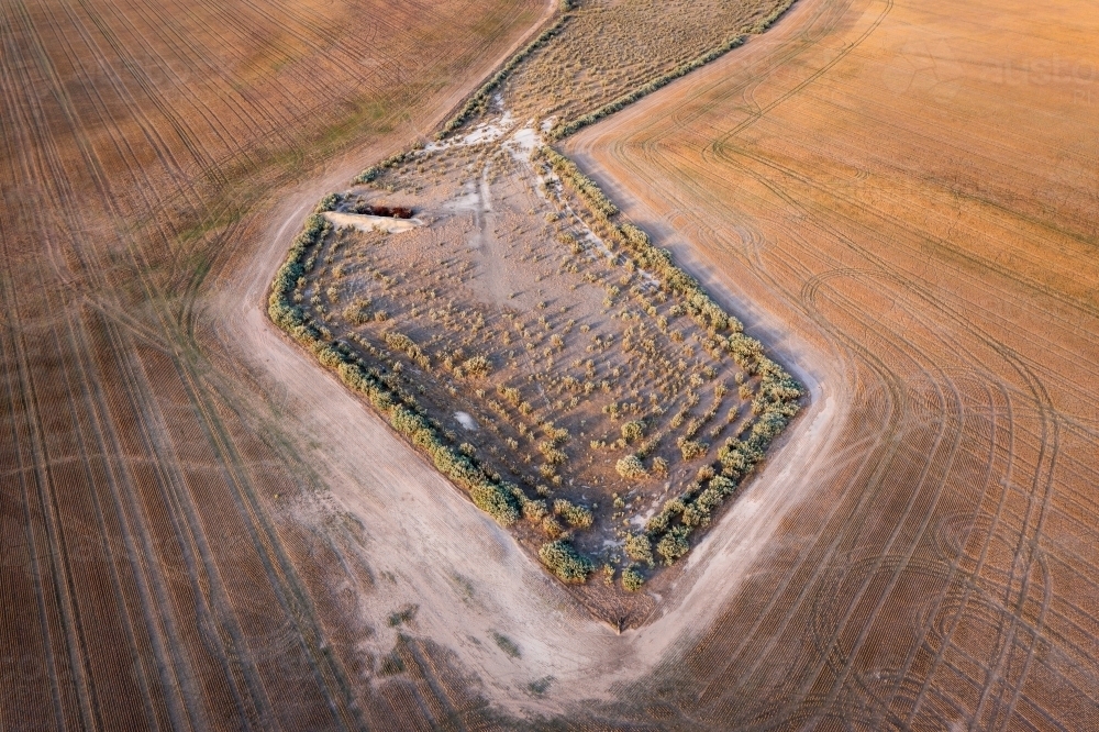Image of Aerial view of an odd shaped dried waterhole on parched ...