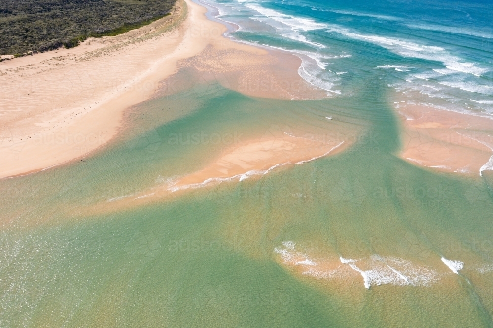 Image of Aerial view of an unspoiled beach and sand bars at the mouth ...