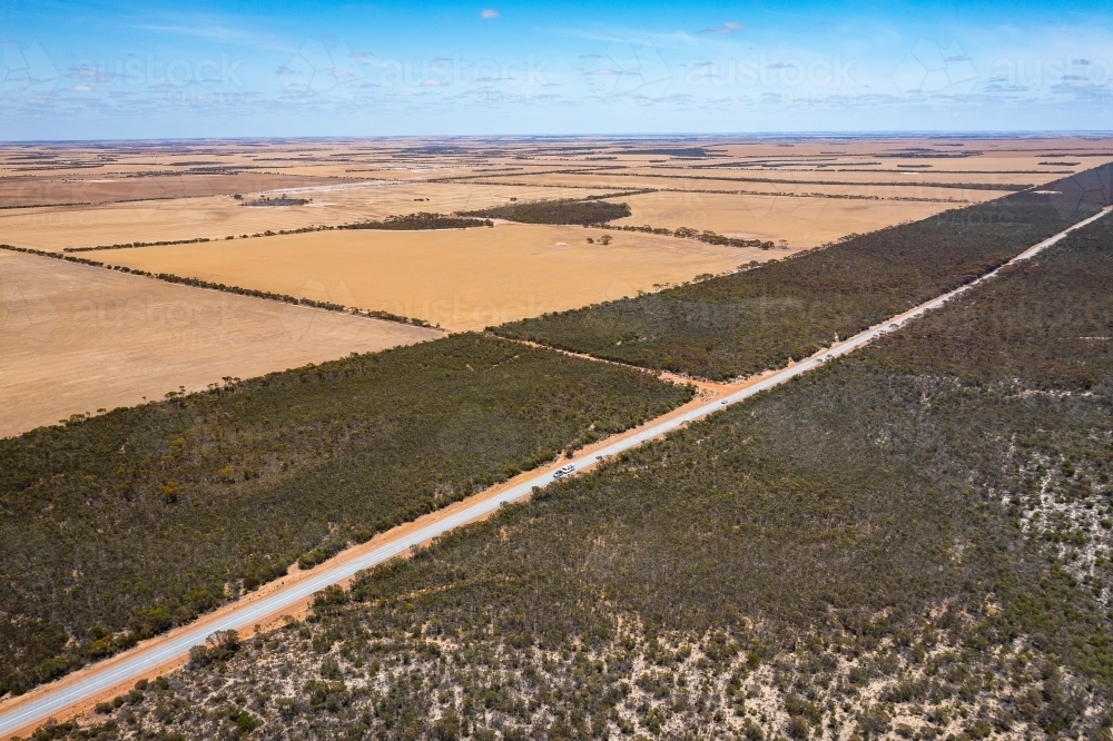 Image of Aerial view of bitumen road and farmland with roadside ...