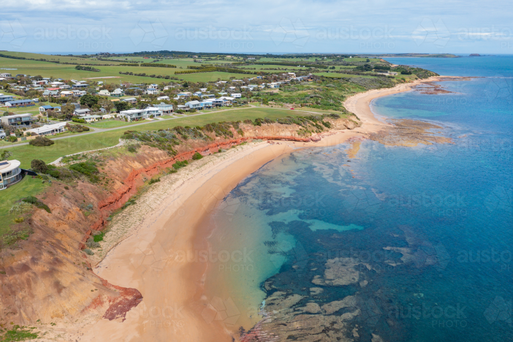 Image of Aerial view of blue ocean and long sandy beaches below a ...