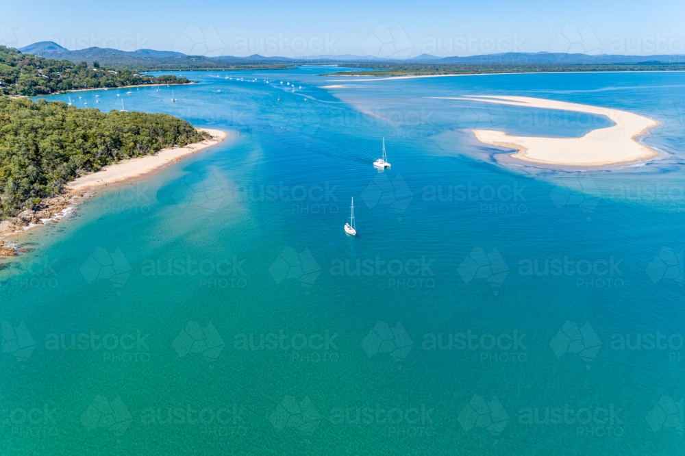 Image of Aerial view of boats anchored in shallow estuary, Seventeen ...