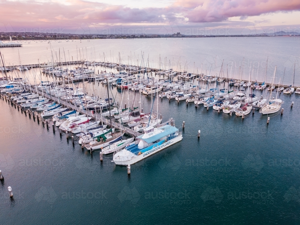 Image of Aerial view of boats and yachts moored at a marina - Austockphoto