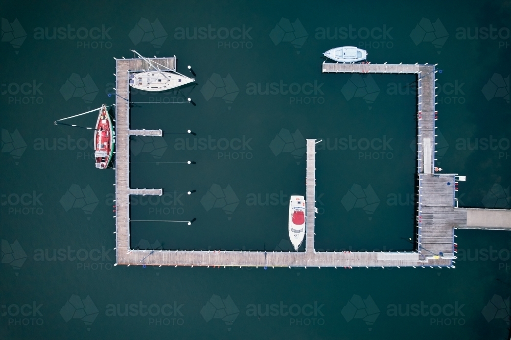 Image of Aerial View of Boats Moored at Jetty - Austockphoto