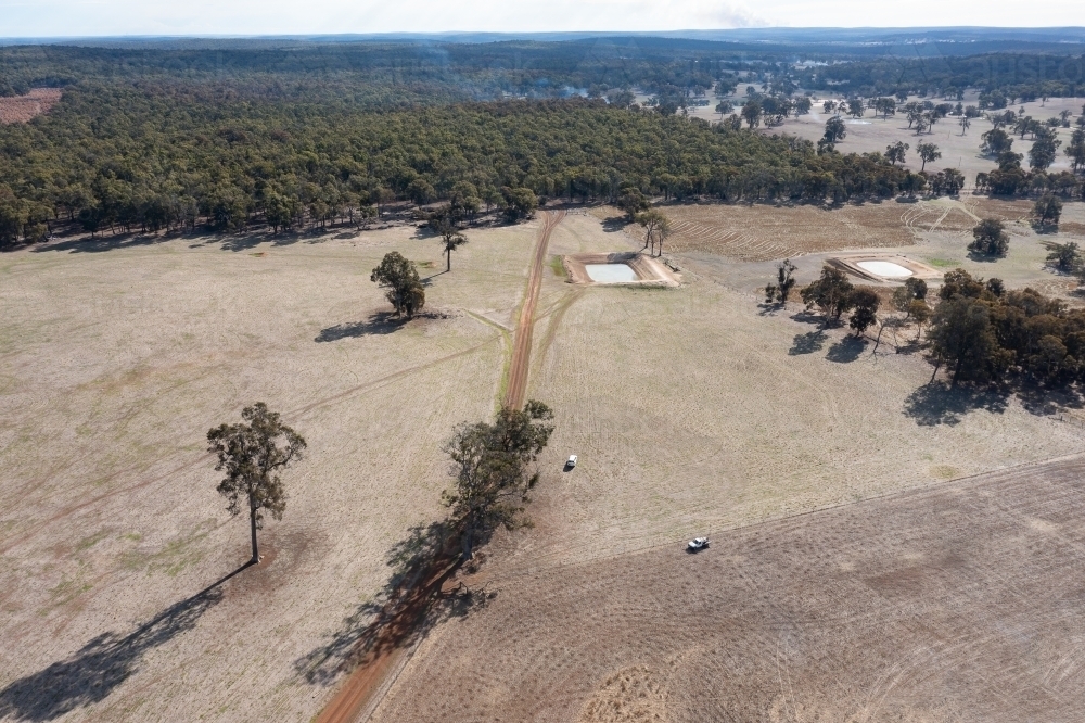 Image of aerial view of bush and farmland with a track and whips of ...