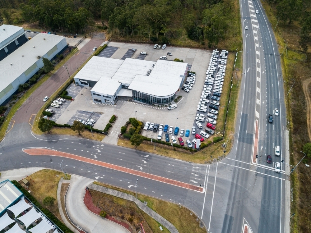 Image of Aerial view of car dealership and intersection on highway ...