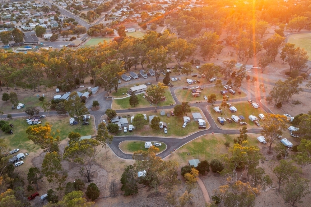 Image of Aerial view of caravan park in a bush setting at sunrise ...