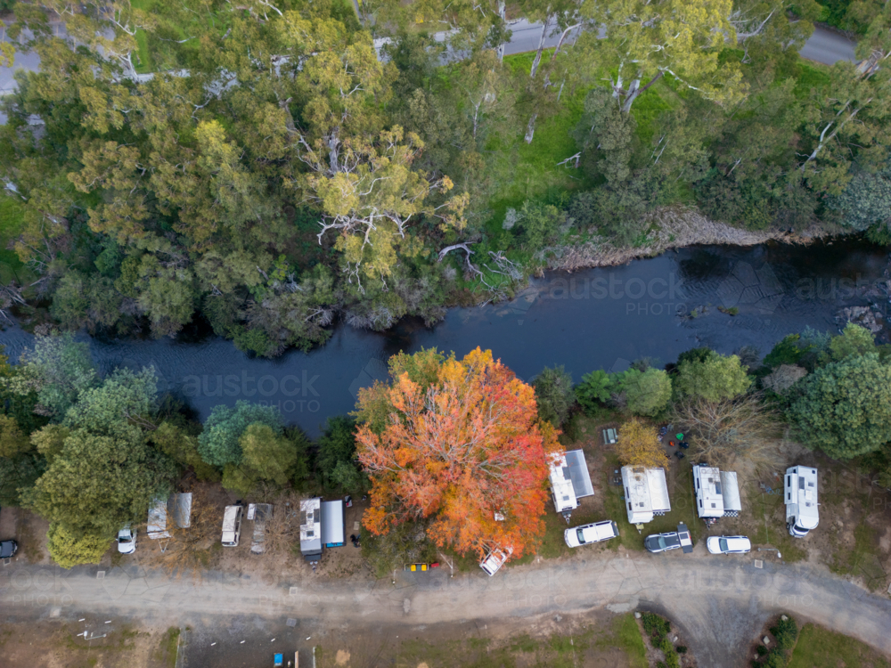 Image of Aerial view of caravan park with autumn coloured trees on the ...