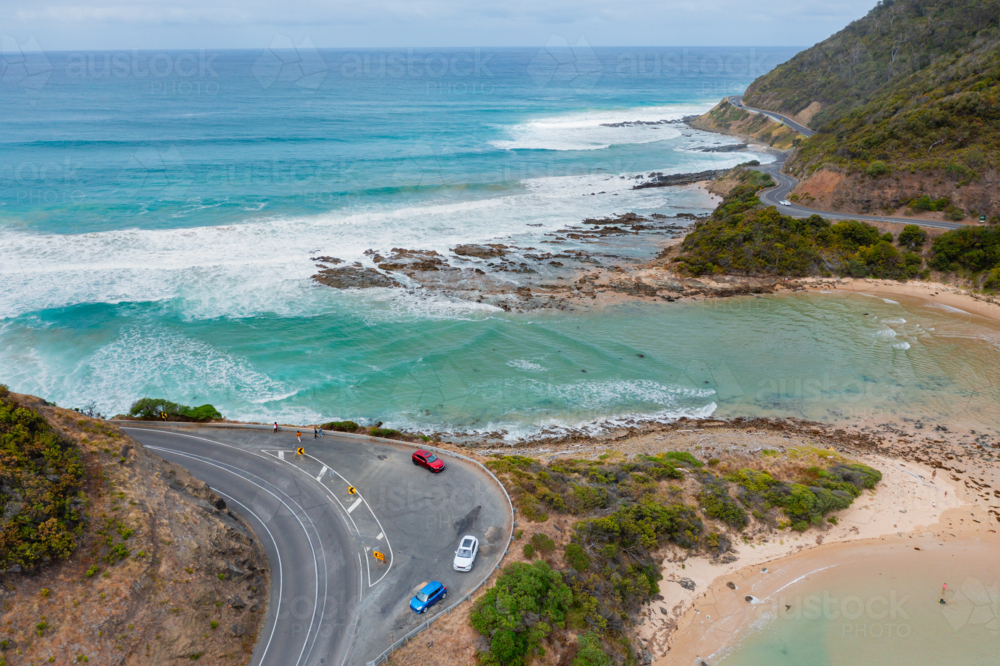 Image of Aerial view of cars parked at a lookout above a river flowing ...
