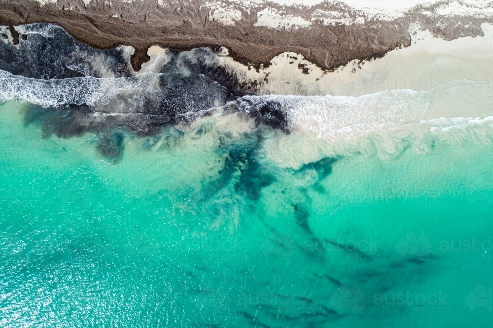 Image of Aerial view of clear water and seagrass on sandy shore ...