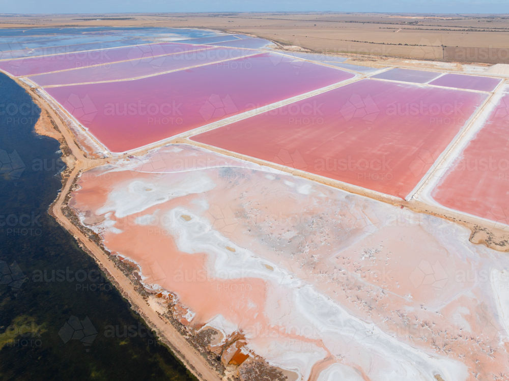 Image of Aerial view of colourful salt evaporation ponds and levee ...