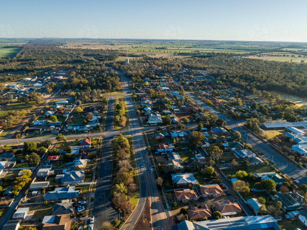 Image of Aerial view of country town on sunny morning homes lining ...