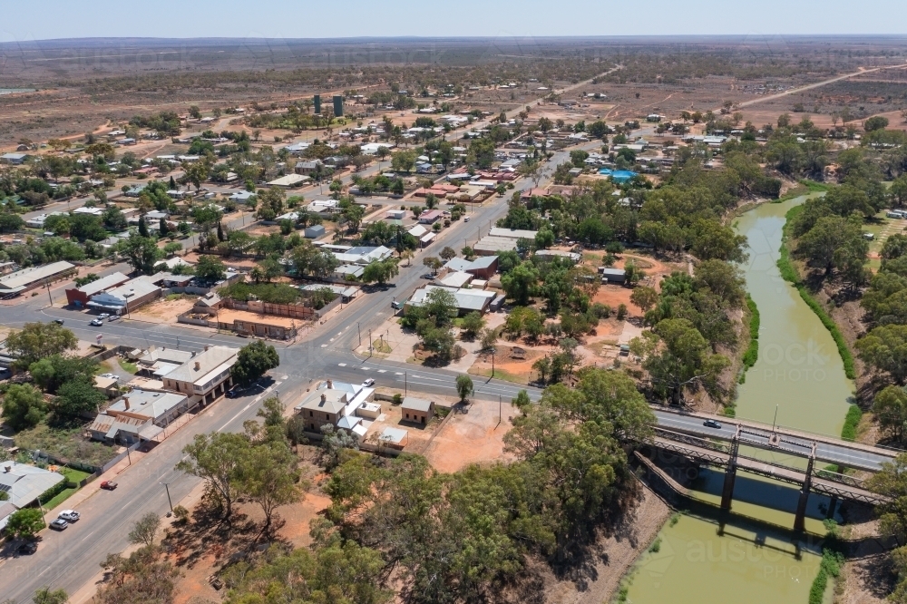 Image of Aerial view of crossroads in a remote outback town next to a ...