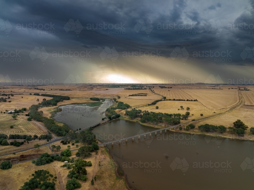 Image of Aerial view of dramatic storm clouds and heavy rain over an ...