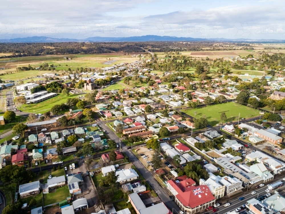 Image of Aerial view of edge of town looking over houses and buildings ...