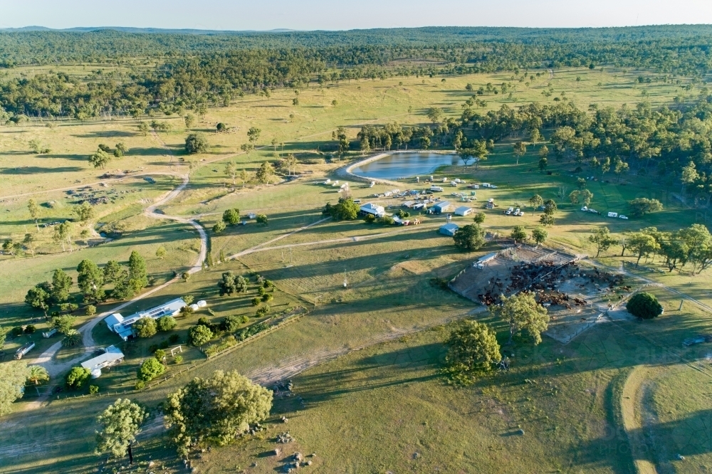 Image of Aerial view of farm homestead and cattle yards. - Austockphoto