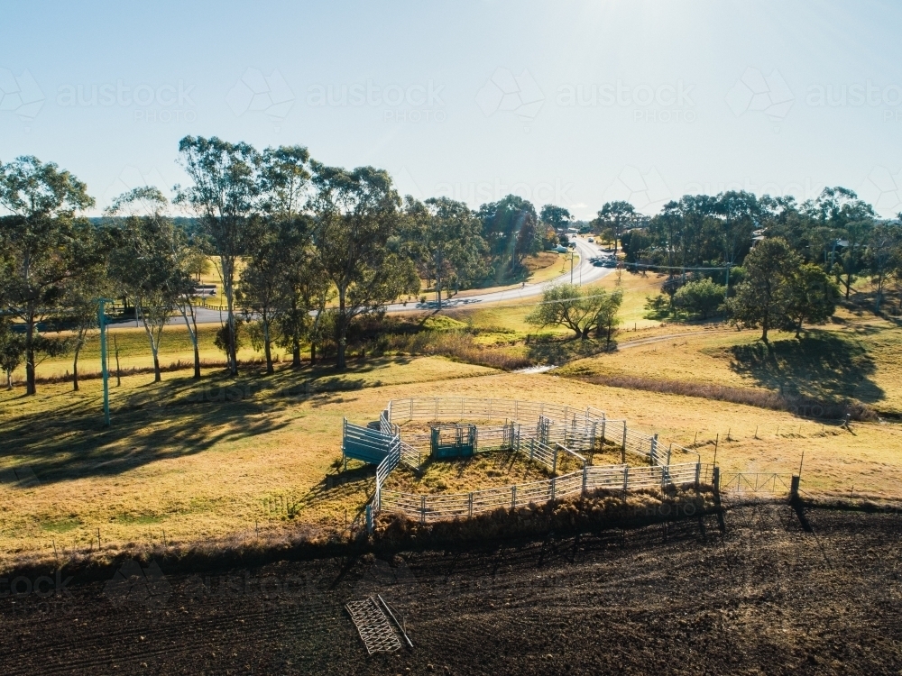 Image of Aerial view of farm land with ploughed paddock and cattle ...