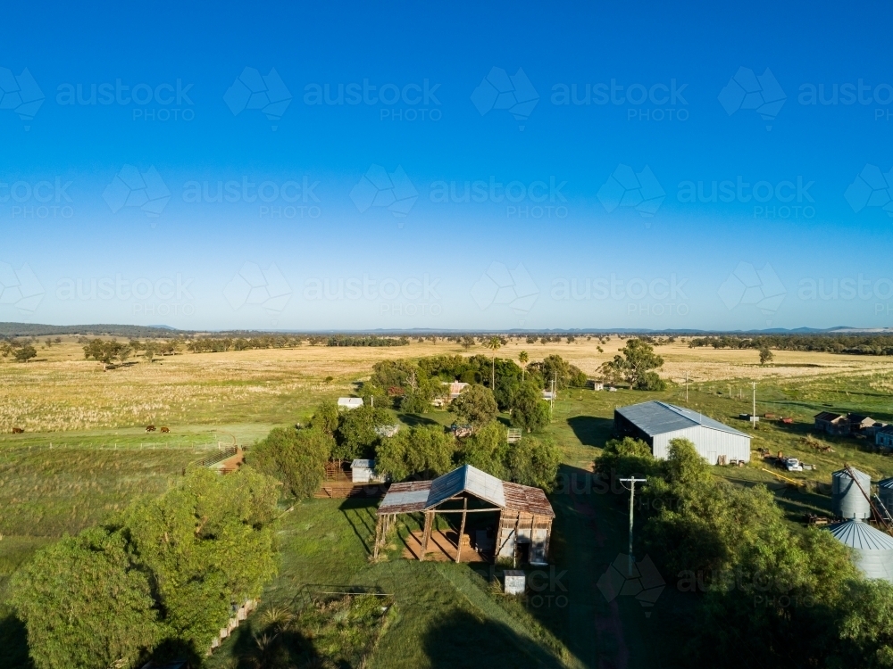 Image of Aerial view of farm property in bright sunlight with leaning ...